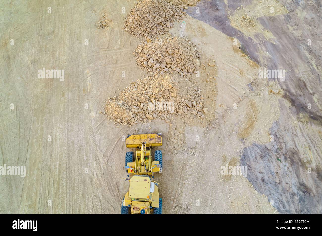 overhead photograph of a bulldozer on a construction site, aerial view ...
