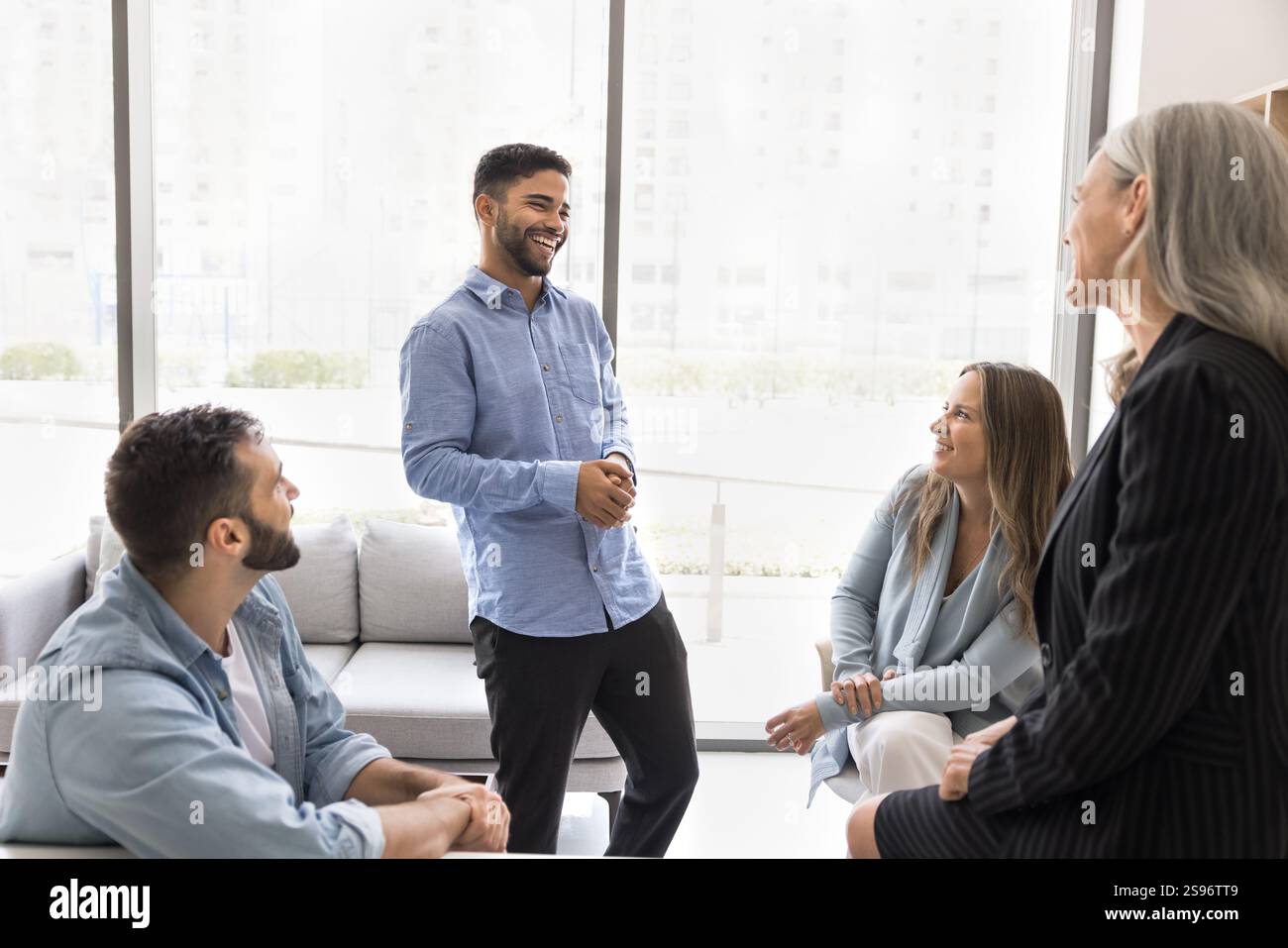 Group of laughing diverse company employees talking during break Stock ...