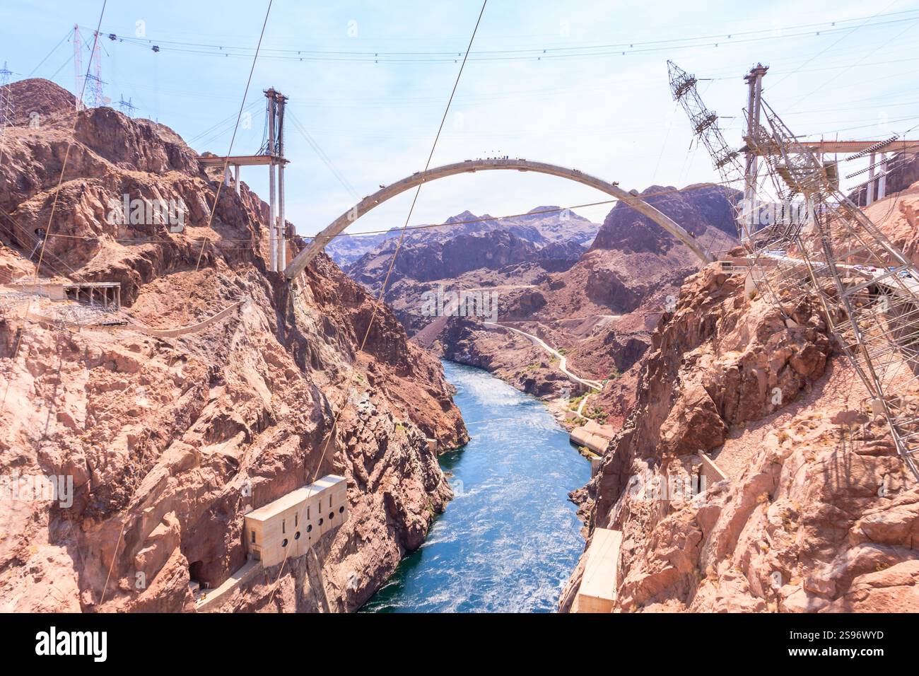 A bridge spans a river in the desert. The bridge is under construction ...