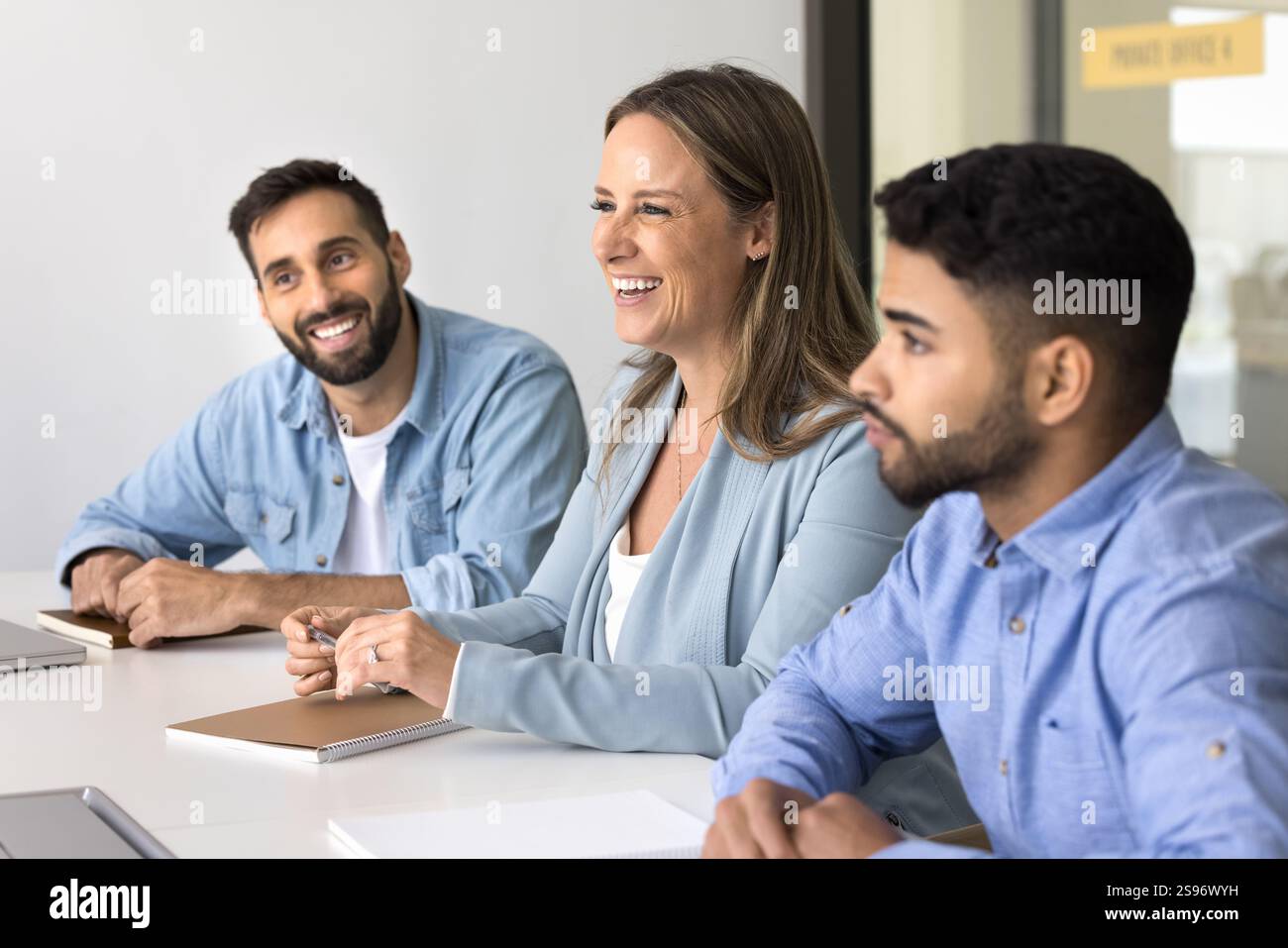 Happy diverse teammates discussing business related matters Stock Photo ...