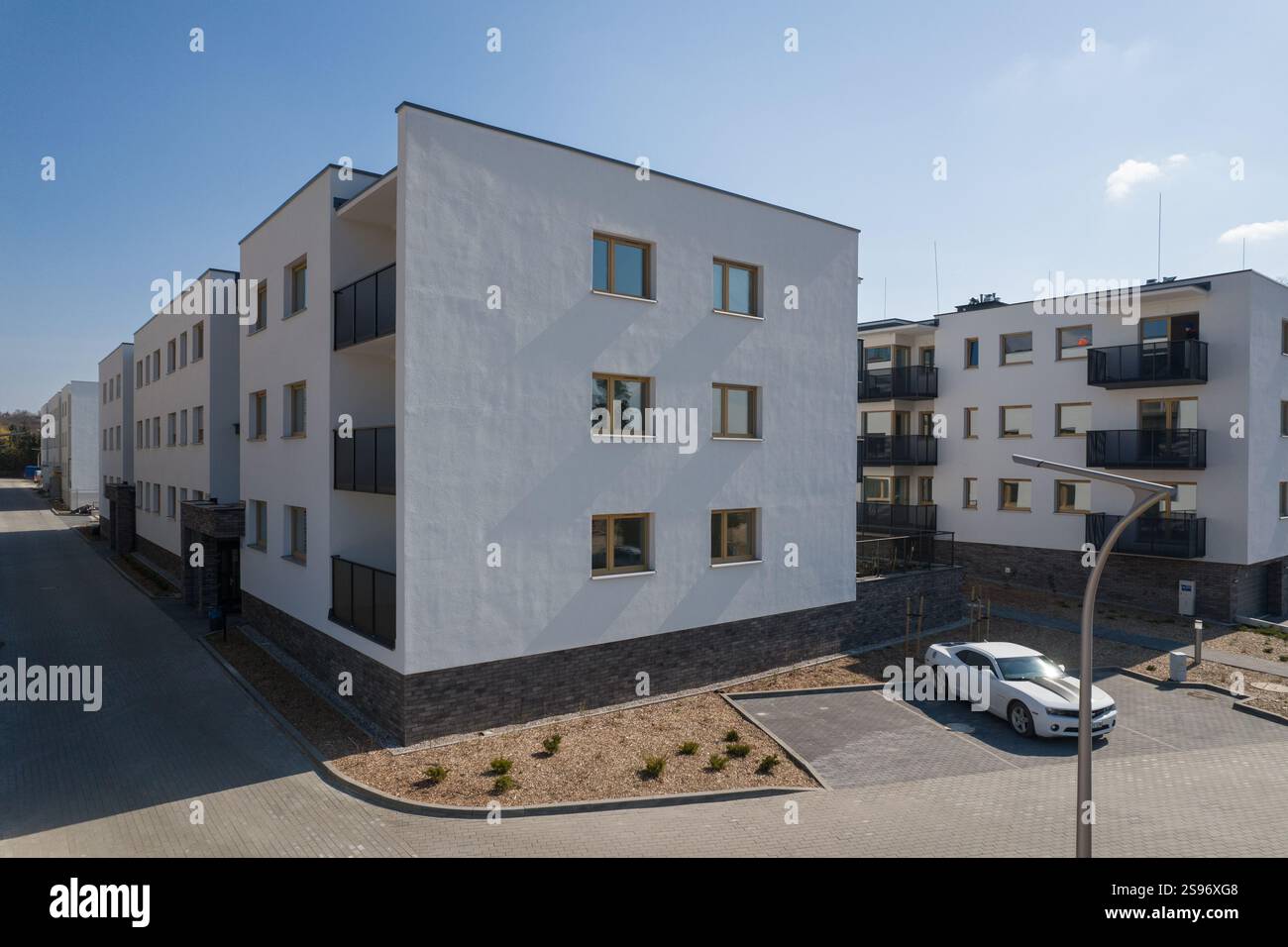 Modern White Apartment Buildings with Car Parking Stock Photo - Alamy