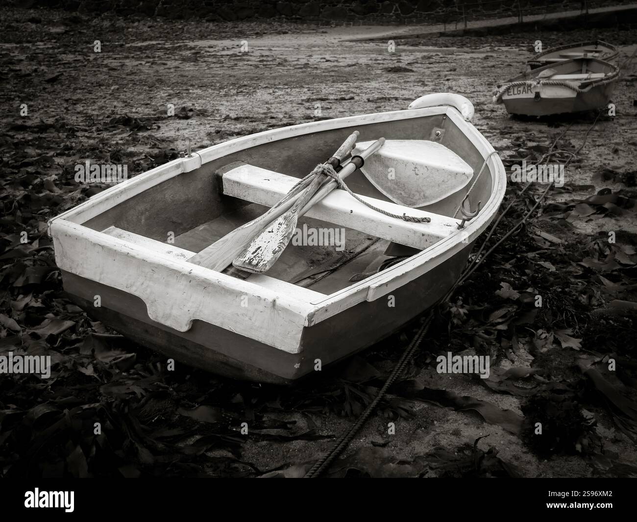 Small inshore fishing boat sat on sand on beach at low tide. Rocquaine ...