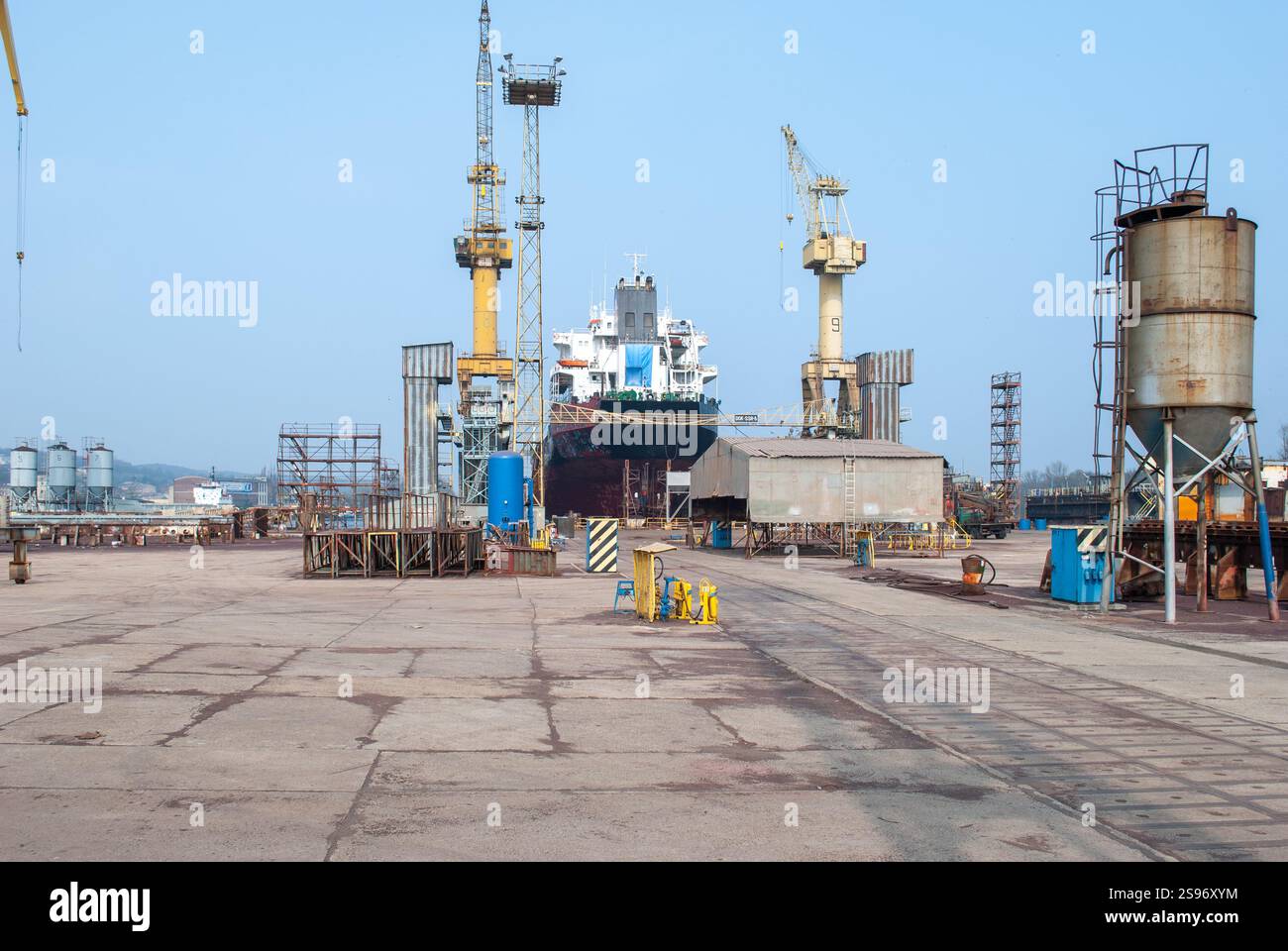 Shipyard with cranes and ship in port Stock Photo - Alamy