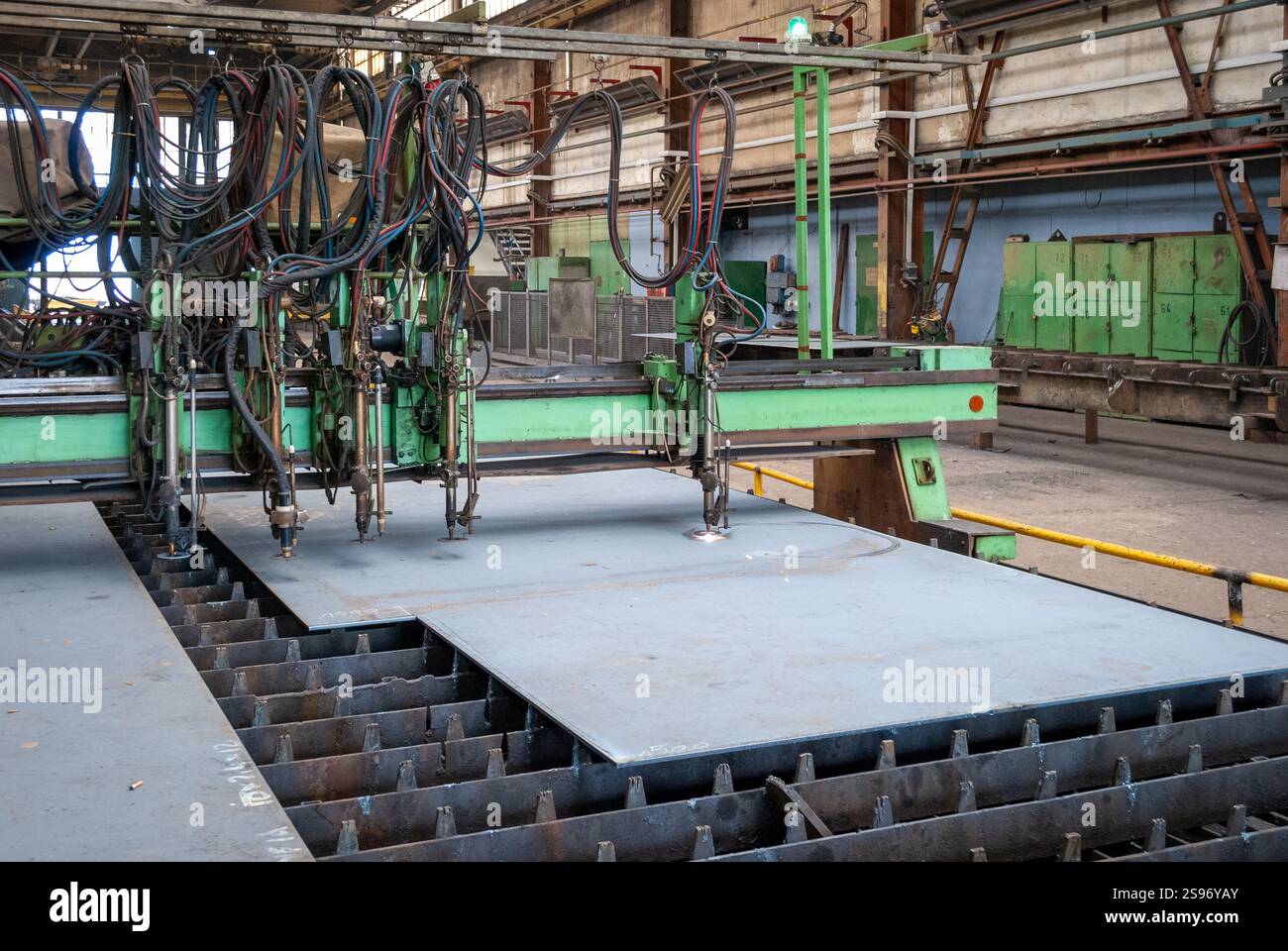 Metal Cutting Machine in Factory Hall Stock Photo - Alamy
