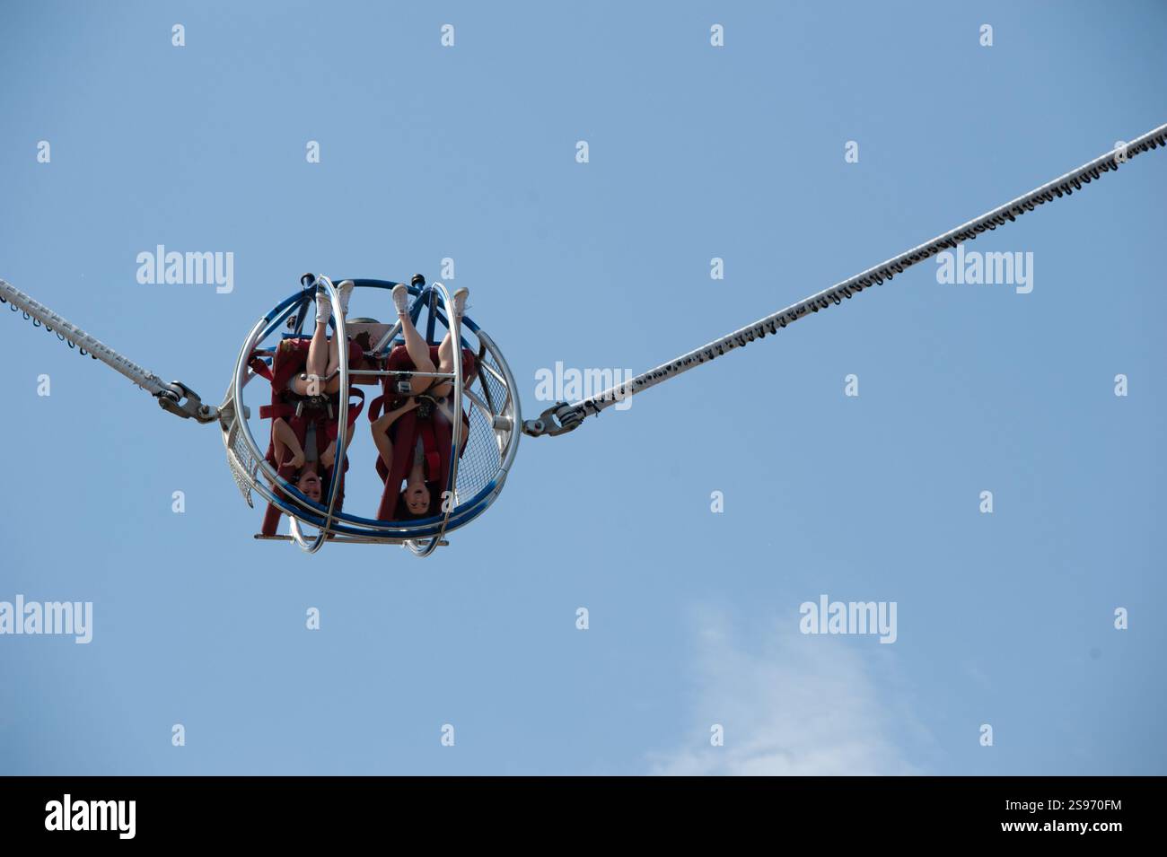 Two People on Slingshot Ride at Amusement Park Stock Photo - Alamy