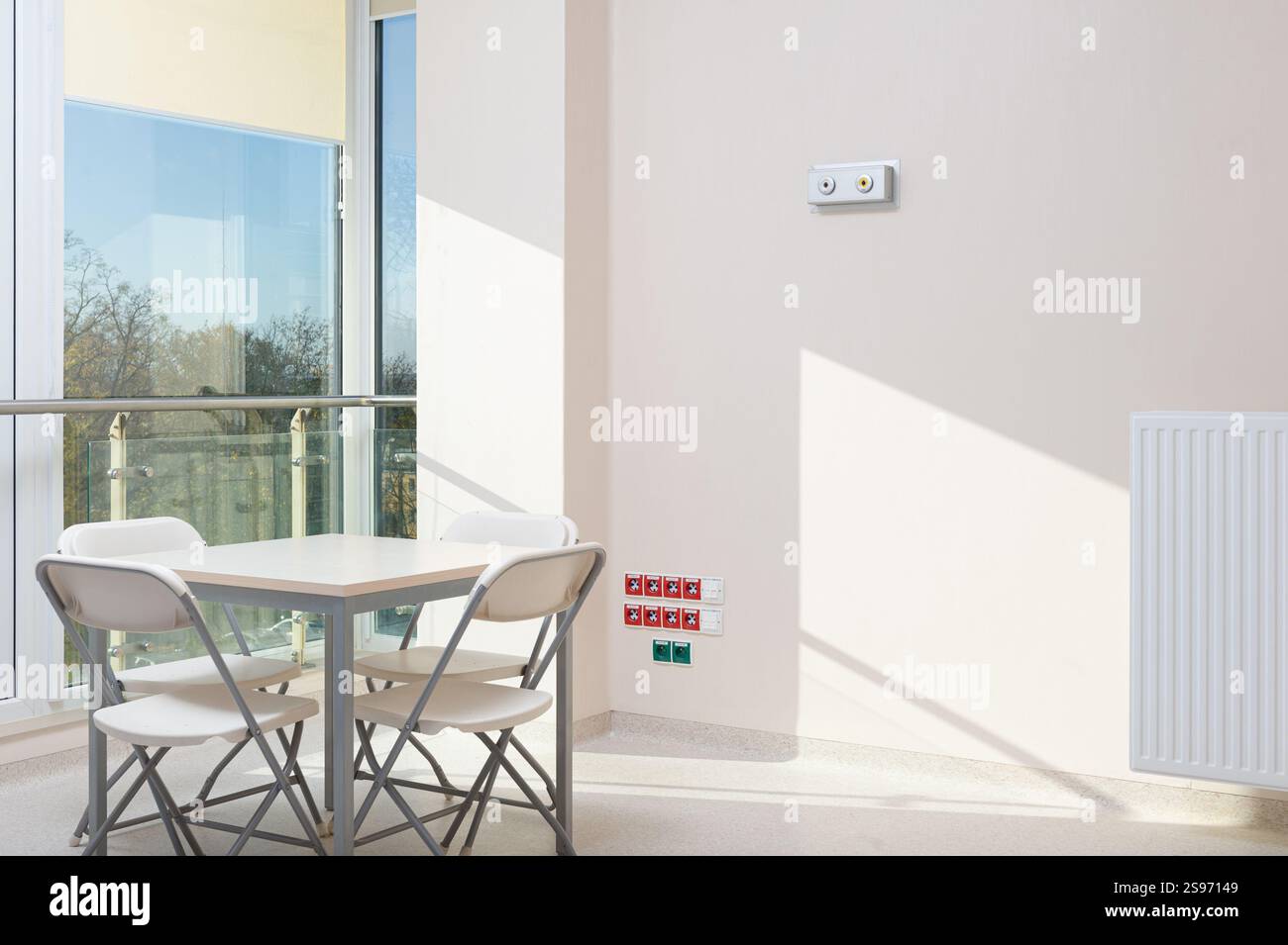 Modern Interior with Table, Chairs, and Control Elements Stock Photo ...