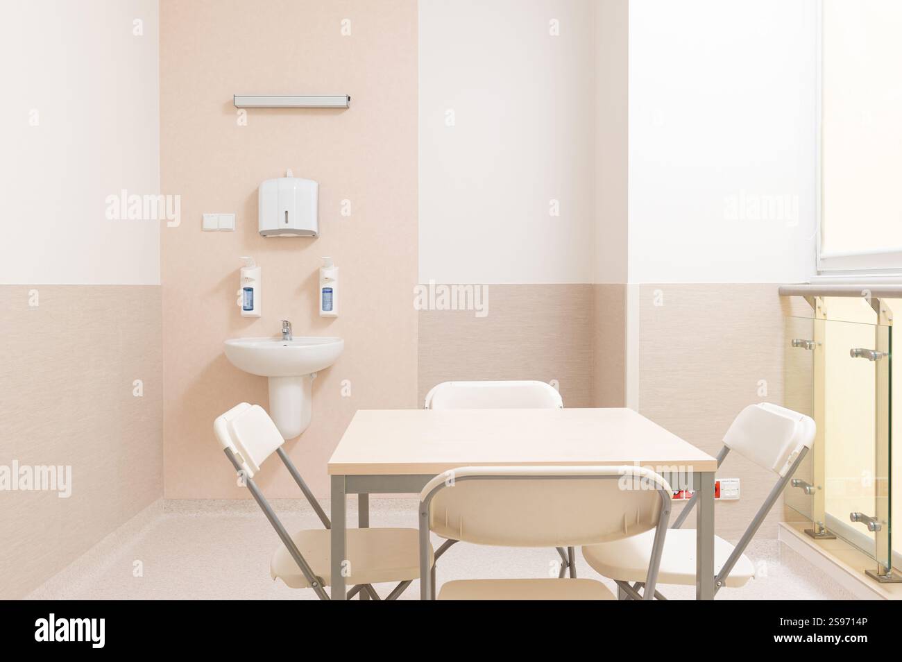 Modern medical Room with Sink, Table and Chairs Stock Photo - Alamy