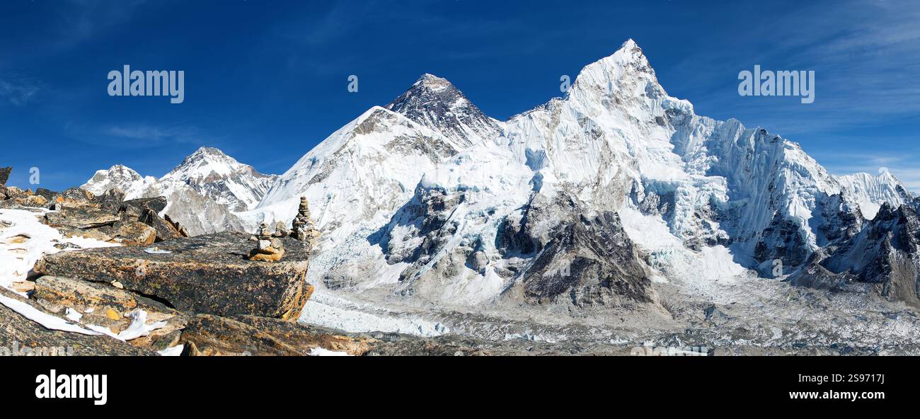 Panoramic view of mount Everest and mt Nuptse peak with stone pyramid ...