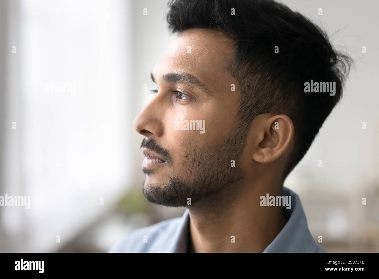 Pensive focused young indian hi-res stock photography and images - Alamy