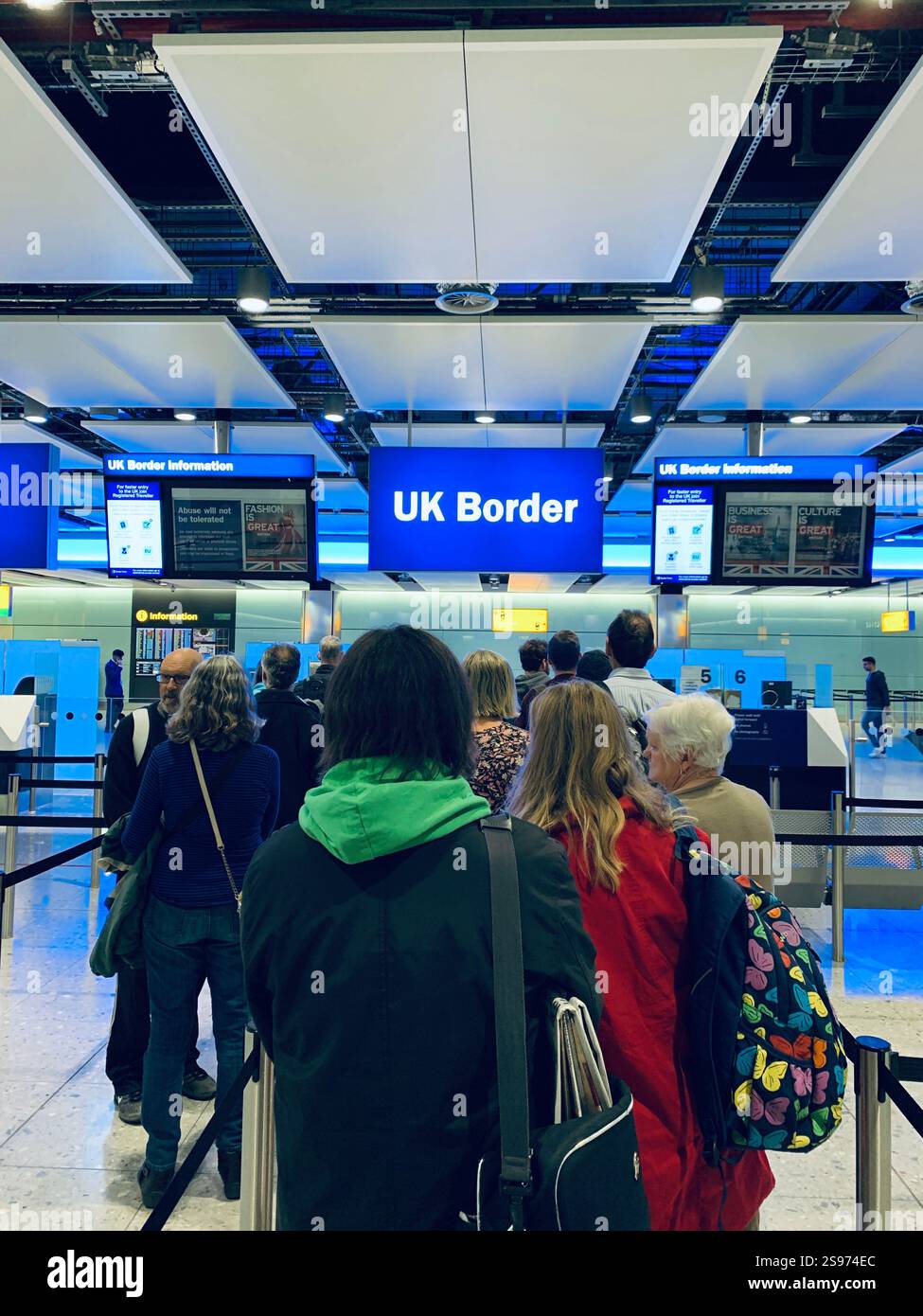 Passengers Queue at UK Border Control Inside Airport Terminal Stock ...