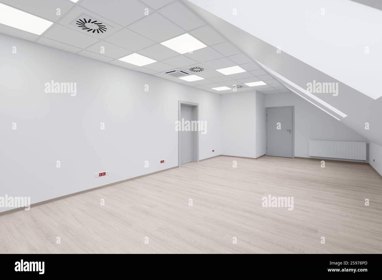 Empty Modern Attic Room with Skylights and Doors Stock Photo - Alamy