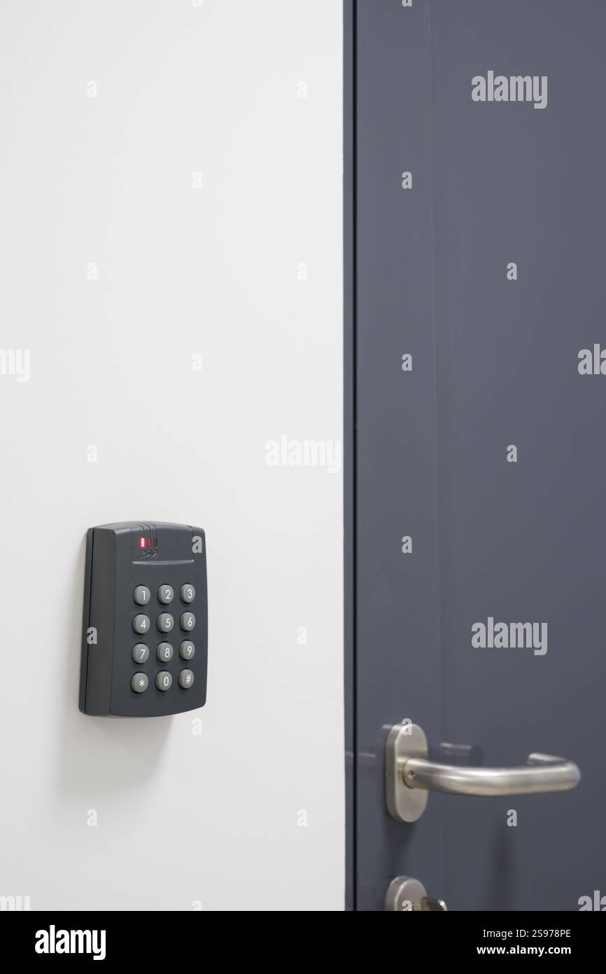 Security Panel and Door Handle on Modern Door Stock Photo - Alamy