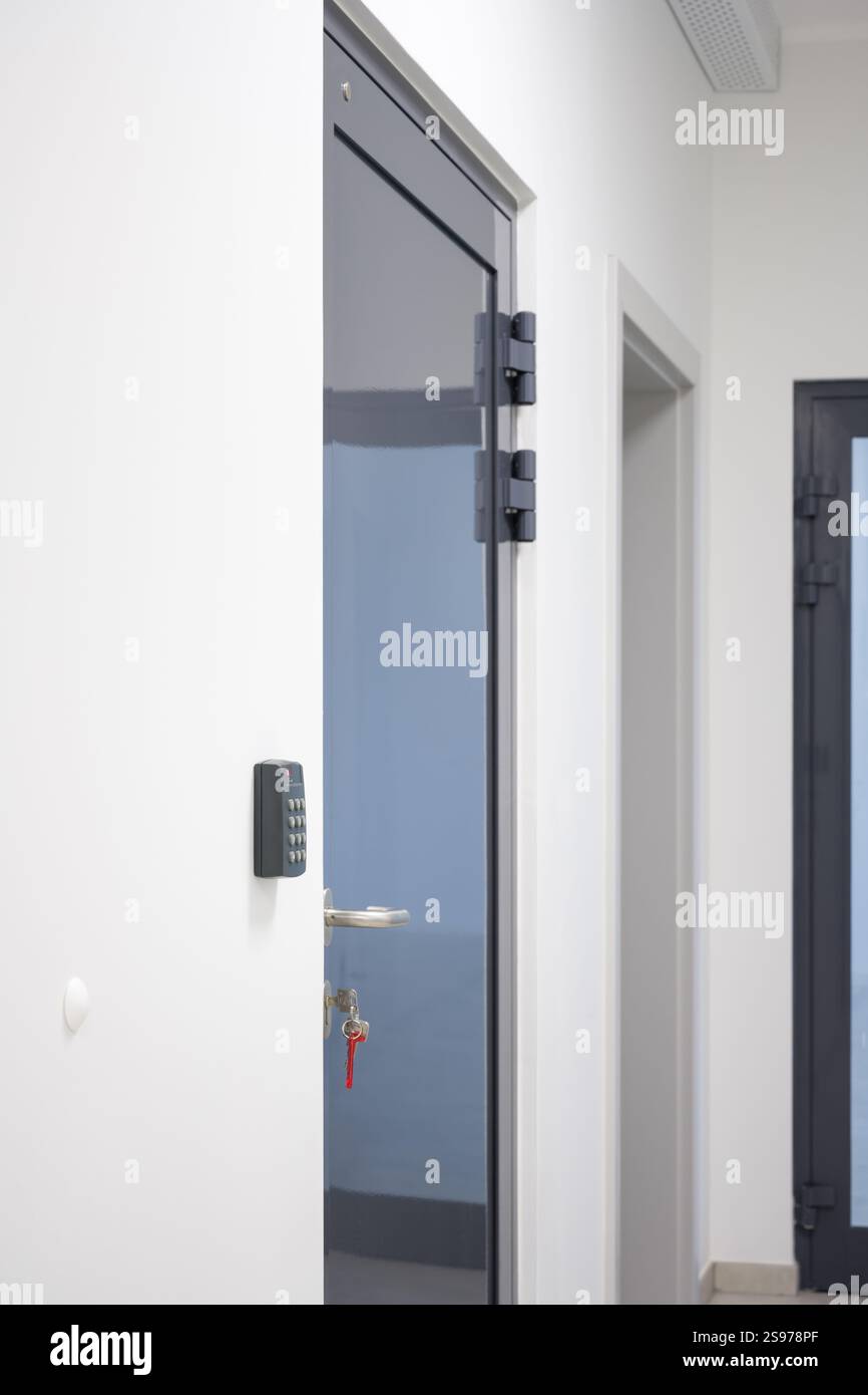 Modern Glass Door with Security Panel and Keys Stock Photo - Alamy