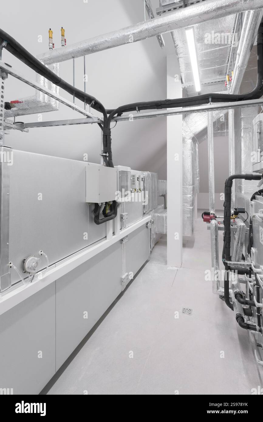 Mechanical Room with Insulated Pipes and Ductwork Stock Photo - Alamy