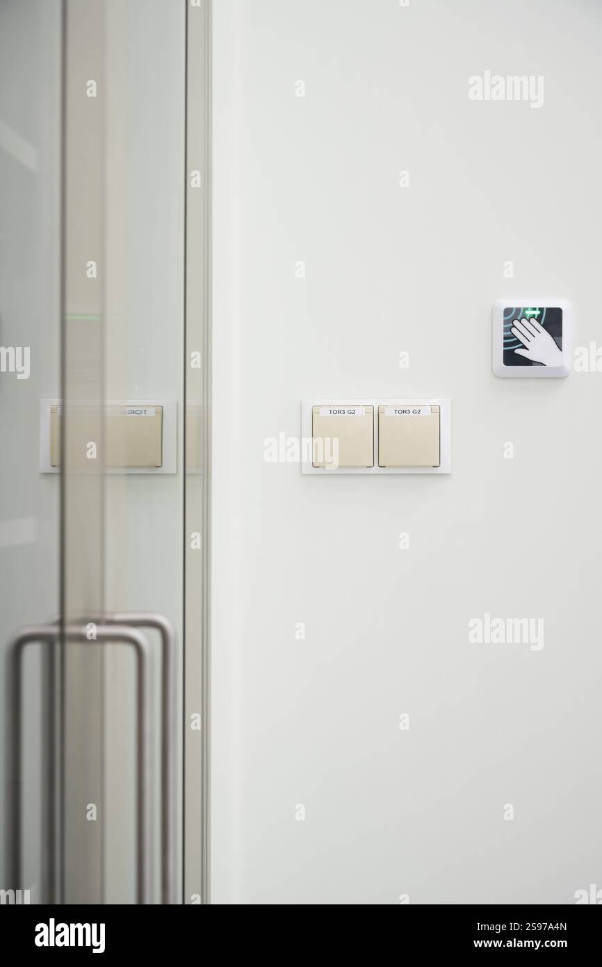 Modern touchless automatic door openers and door details Stock Photo ...