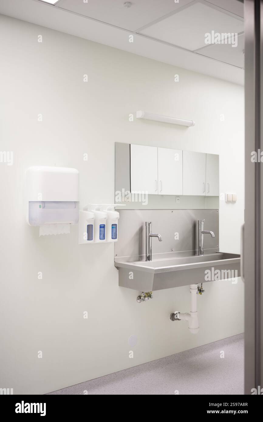 Modern Hospital Scrub Room with Stainless Steel Sinks and Door Stock ...