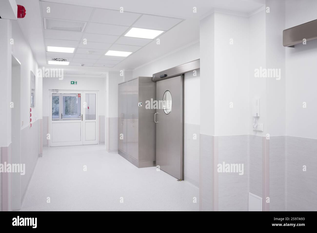 Modern Hospital Hallway with Stainless Steel Door and Exit Sign Stock ...