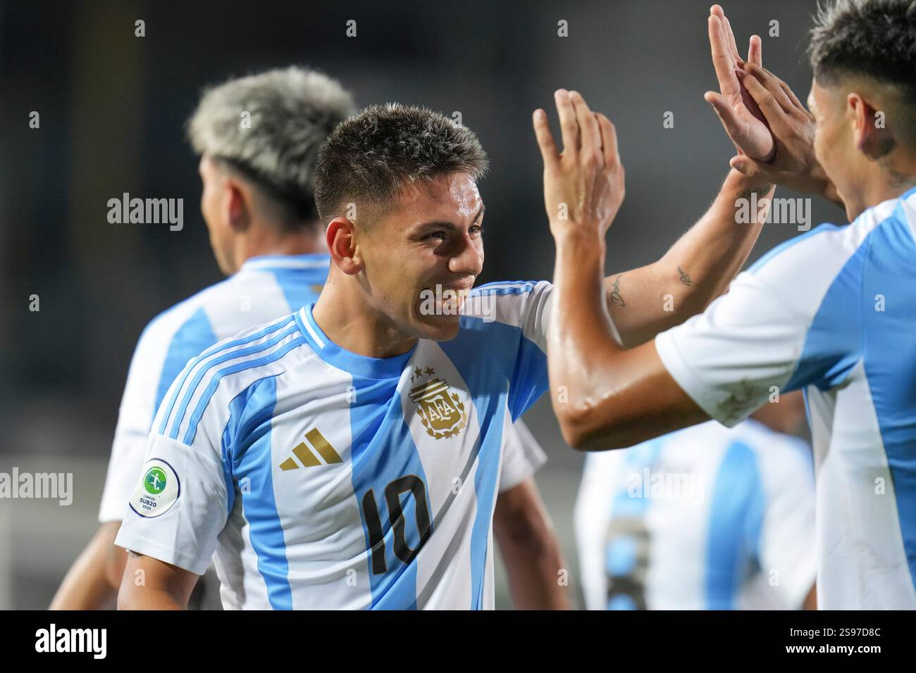 Argentina's Claudio Echeverri, front left, celebrates with teammates ...