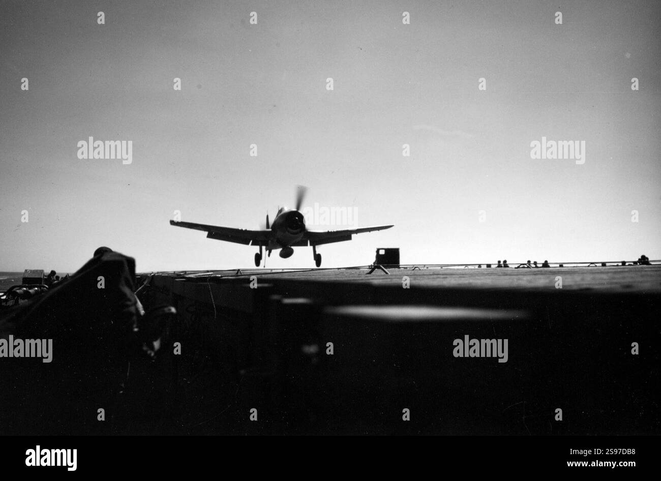 Grumman F6F-3 Hellcat landing aboard USS Cowpens (CVL-25), circa in mid ...