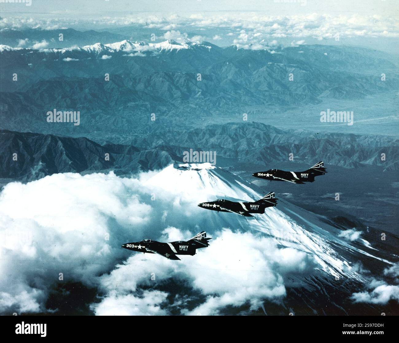 Grumman F9F-6 Cougars of VF-153 fly over Mount Fuji, Japan, 12 December ...