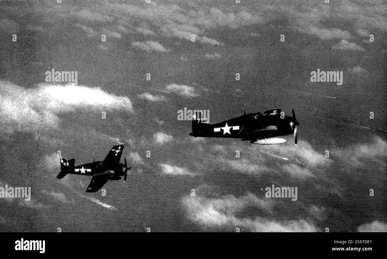 Grumman F6F-5 Hellcats of VF-82 in flight over the Pacific Ocean, in ...