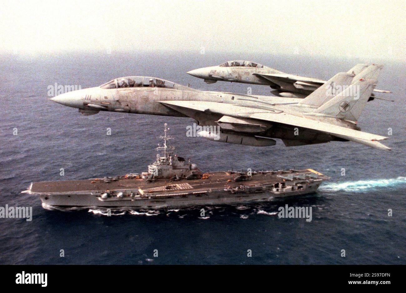 Grumman F-14A Tomcats of VF-14 fly over French aircraft carrier Foch ...