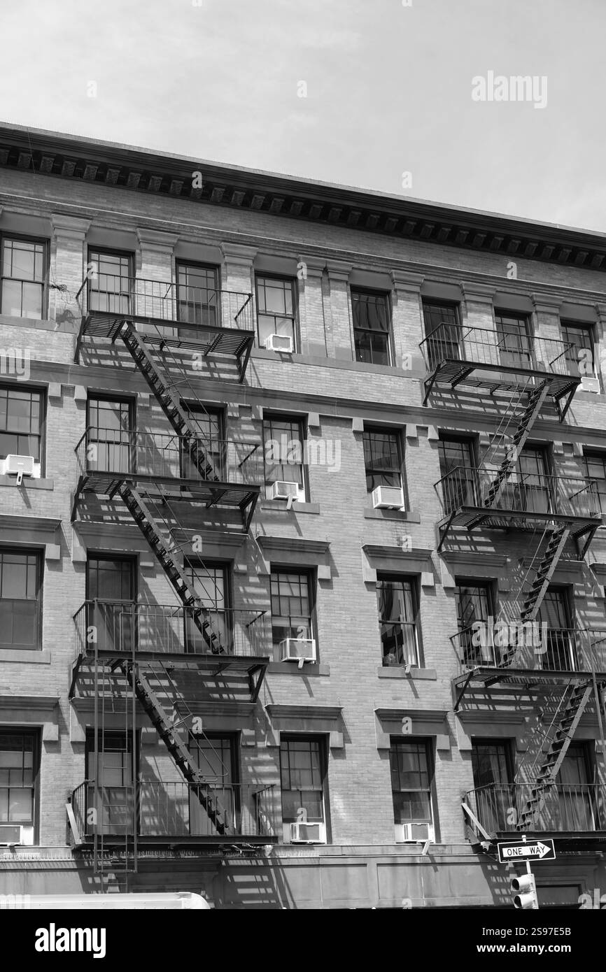 Fire escape ladder. Detail view of an old building with a brick wall ...
