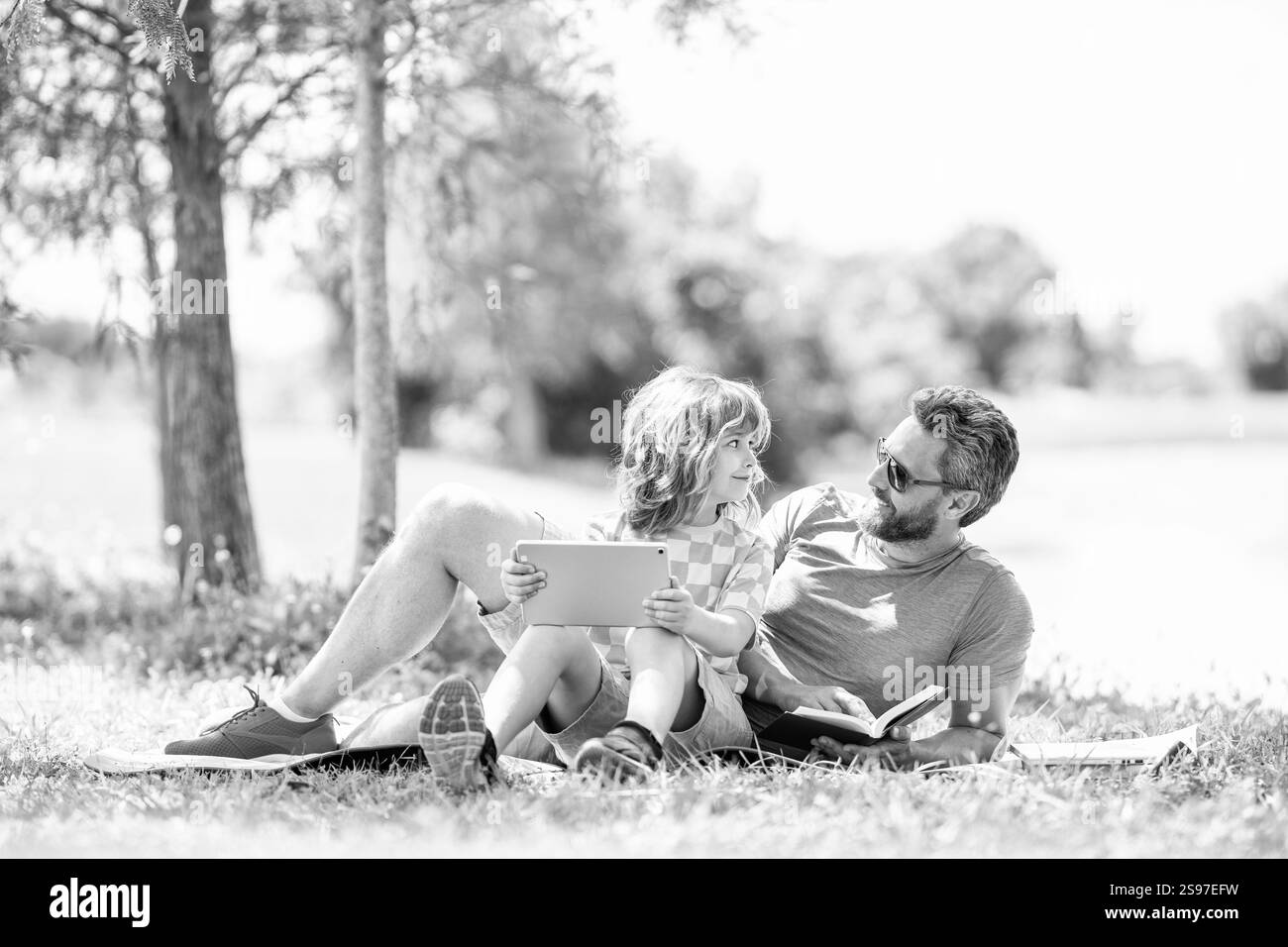 Father and son child relax in park. childhood school education. son ...