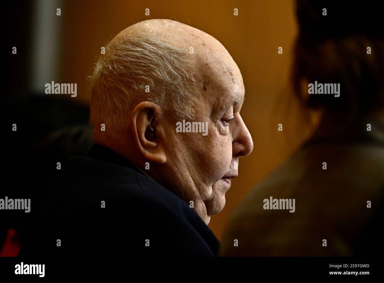 David Moskovic, a Holocaust and Auschwitz Survivor, listens during an ...