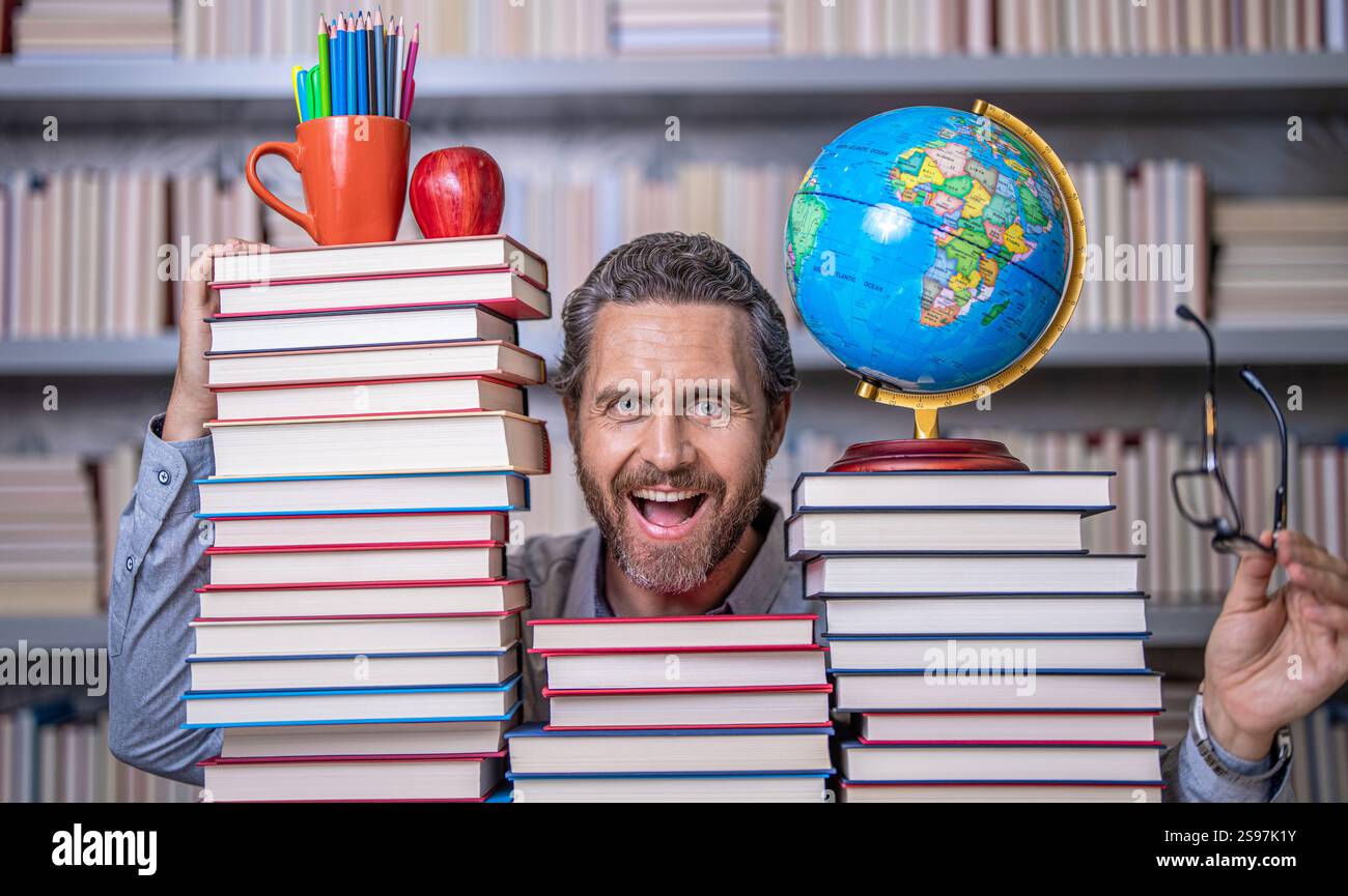 bookworm man in classroom. school teacher with book literature ...