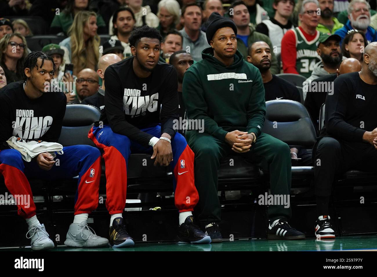 Philadelphia 76ers' Kyle Lowry, right, watches from the bench before an ...