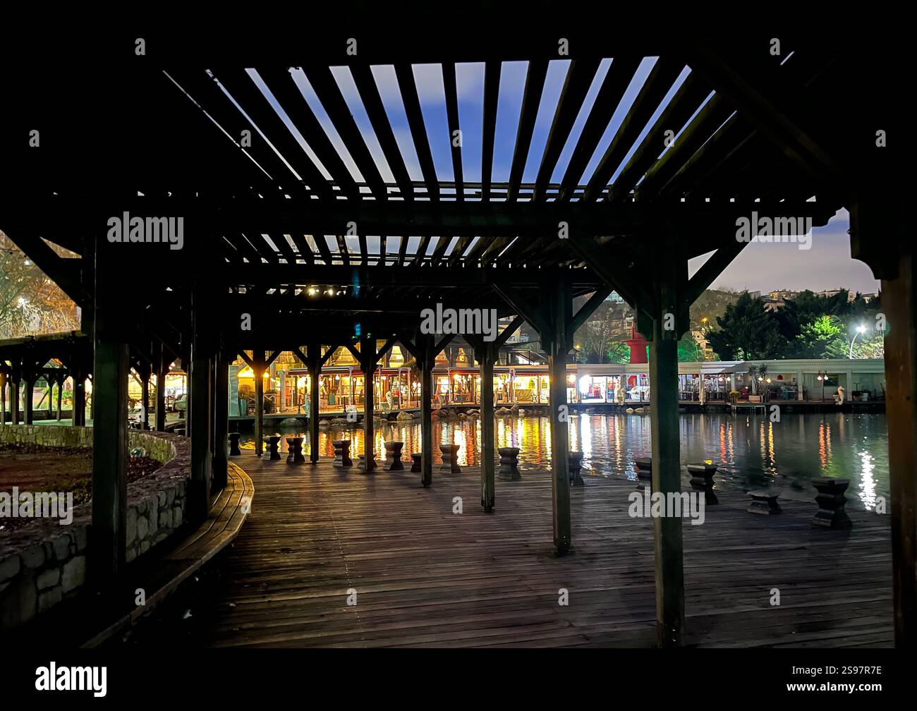 Pergola and artificial lake park view at night in Istanbul, Turkey ...