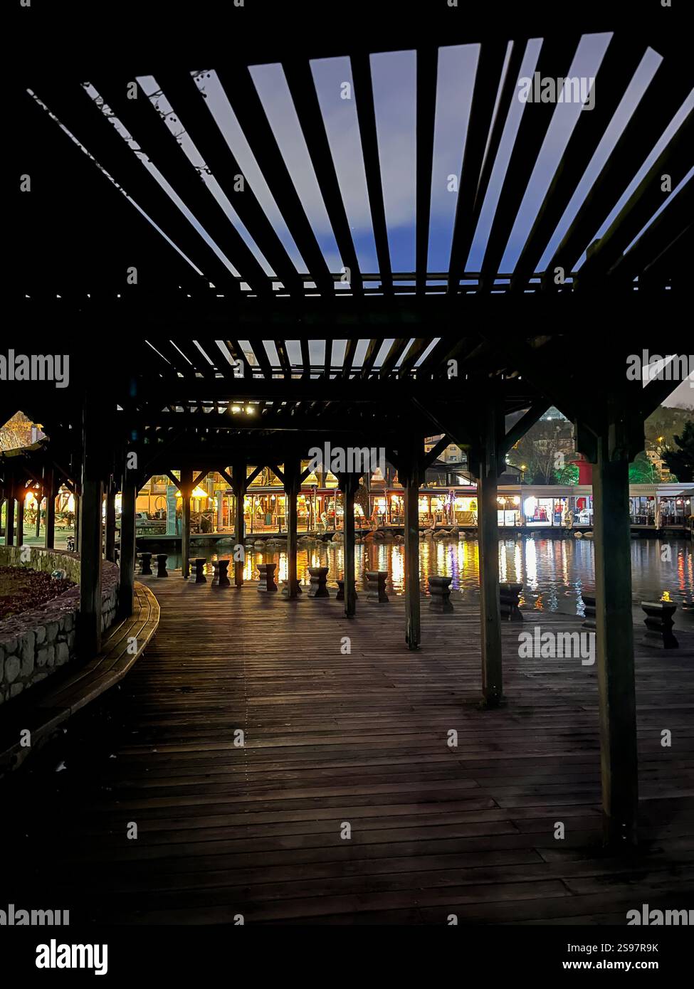 Pergola and artificial lake park view at night in Istanbul, Turkey ...