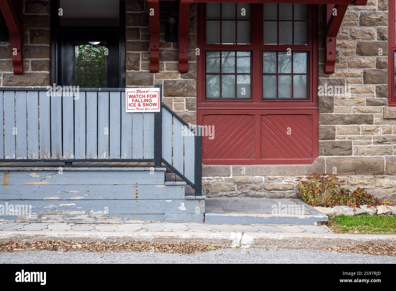 Wooden steps entry into stone building Stock Photo - Alamy