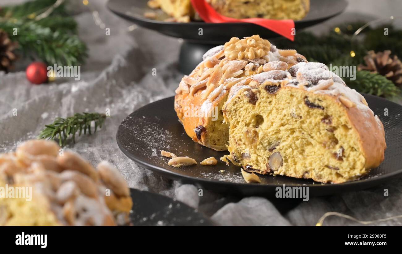 A slice of Bolo Rainha, a traditional Portuguese sweet bread, dusted ...