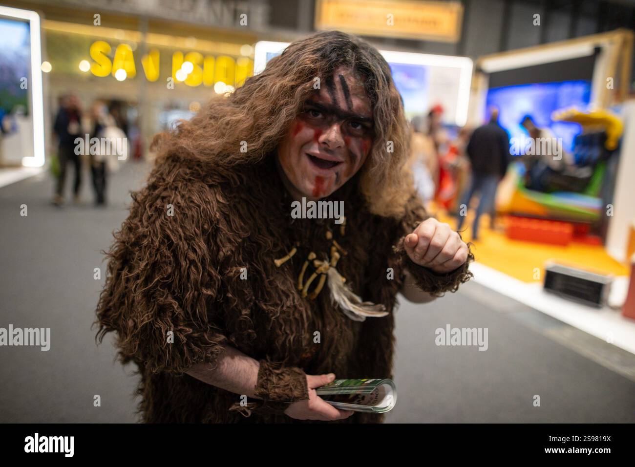 A woman dressed as a caveman poses in one of the corridors of the ...