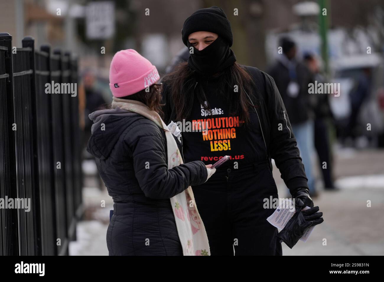 Activist Lapis Marigold with Revcom Corps Chicago talks to people ...