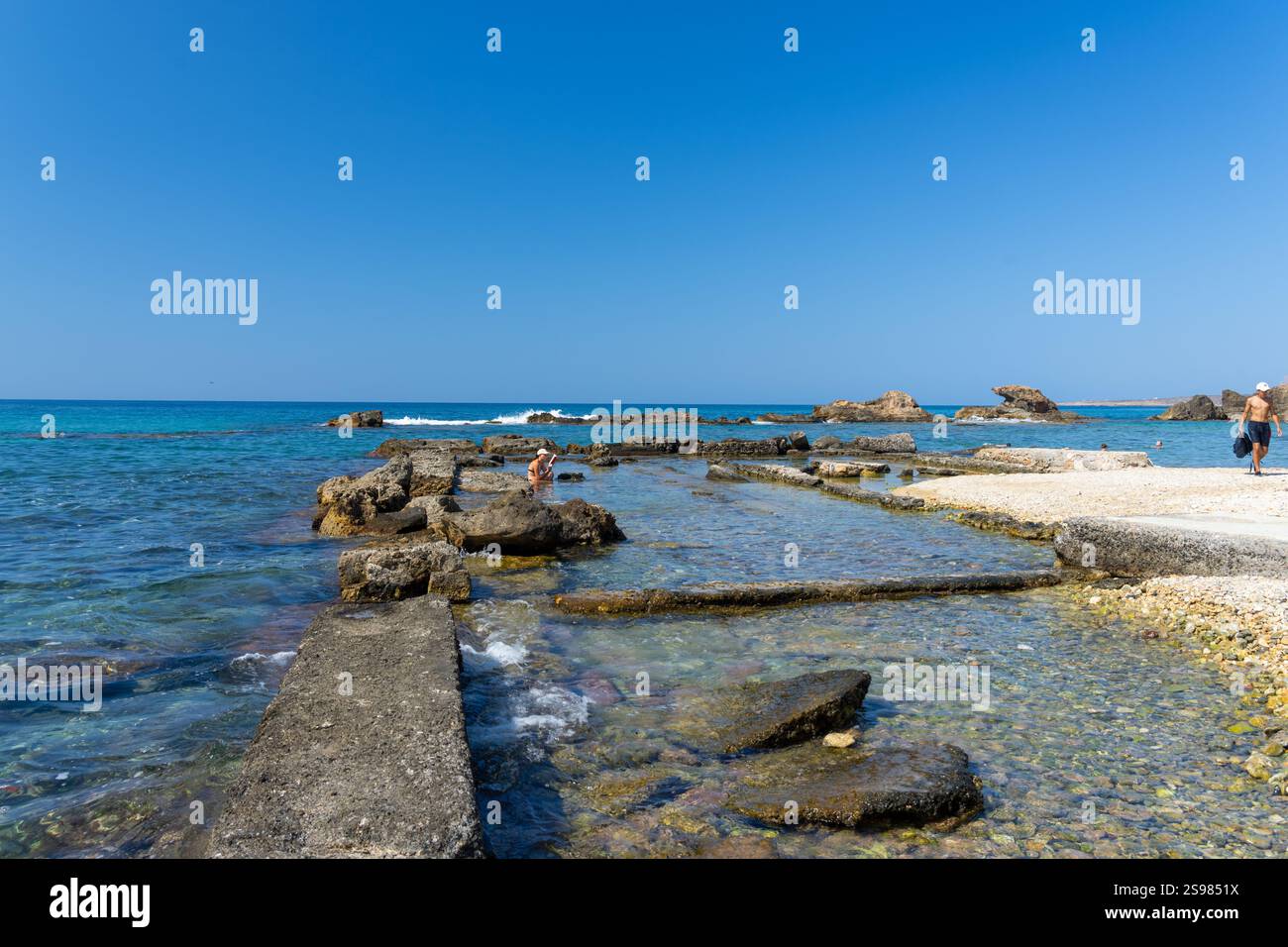Chania Crete - August 15 2024; Old concrete and rock pools on beach ...