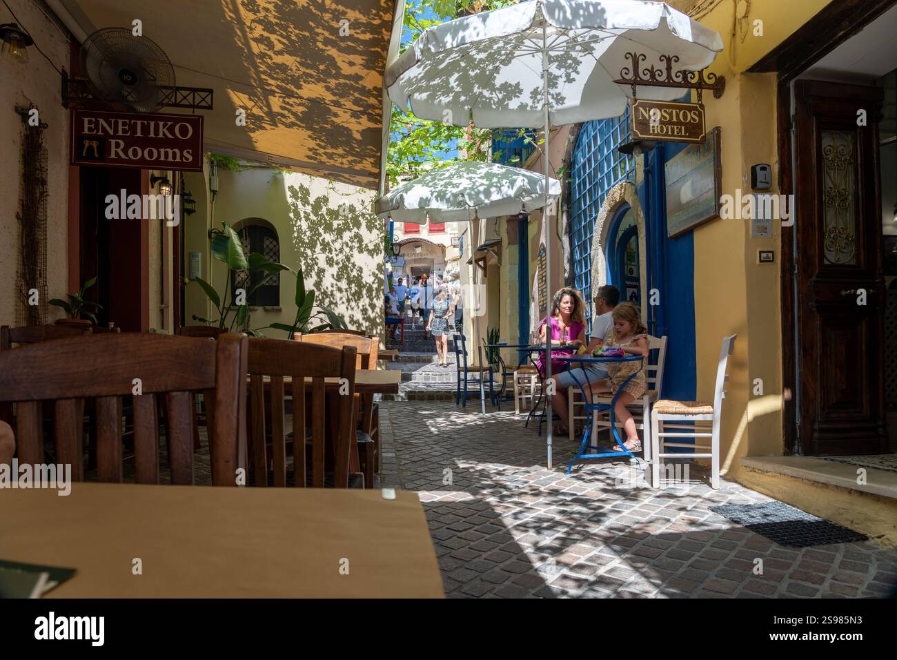 Chania Crete - August 15 2024; Tourist family of three having cool ...