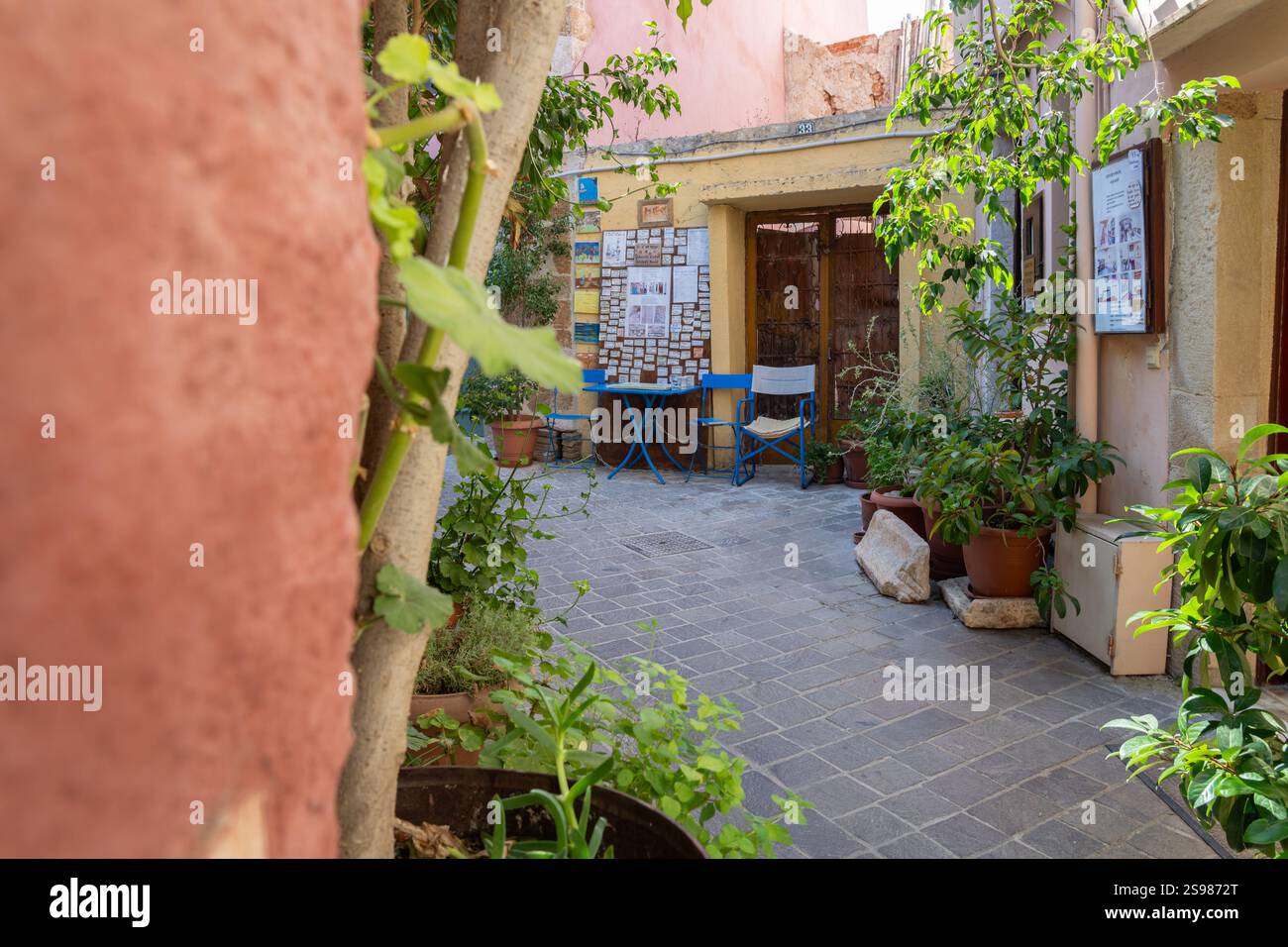 Chania Crete - August 15 2024; Cobblestone path leading between ...