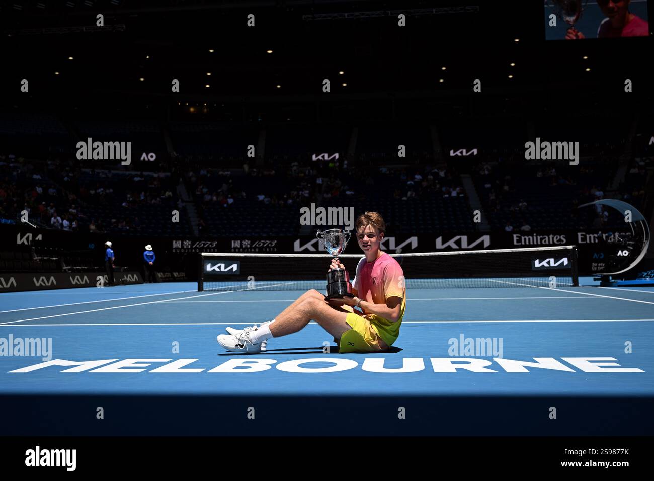 Henry Bernet of Switzerland holds the winners trophy following his ...