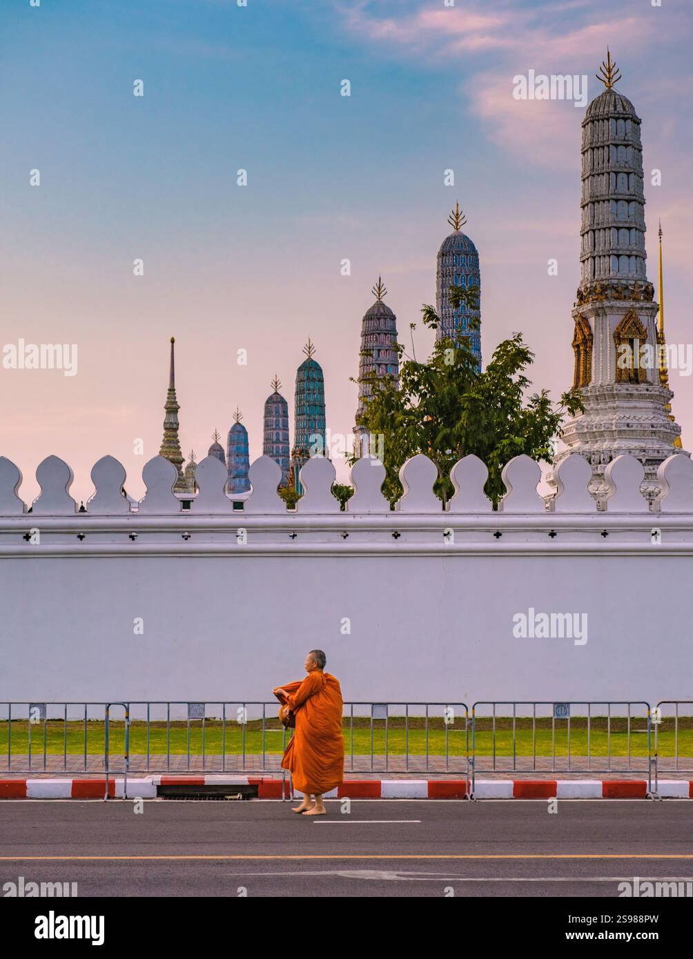Bangkok Thailand 10 January 2025, a serene monk strolls along a quiet ...