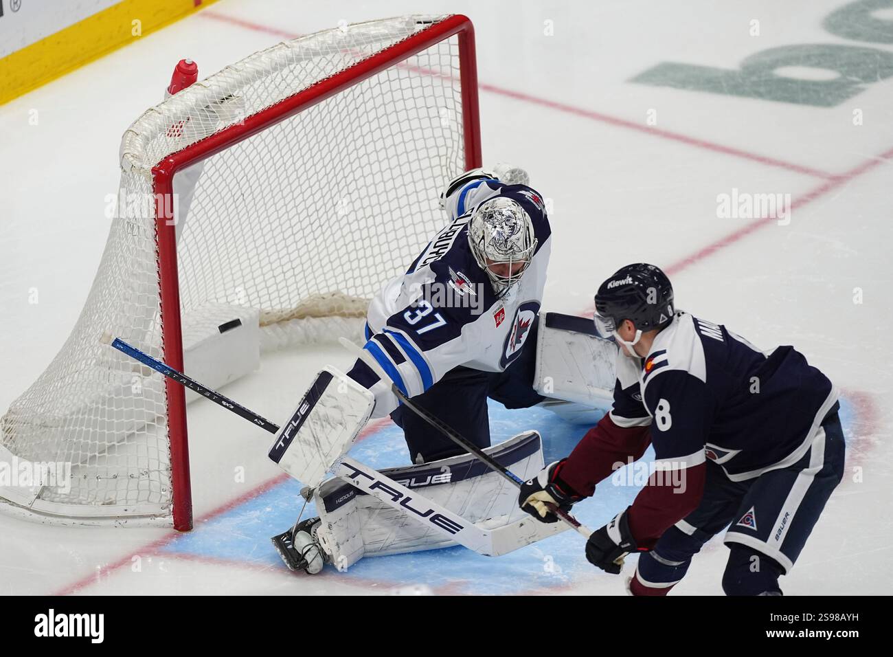 Winnipeg Jets goaltender Connor Hellebuyck (37) deflects a shot from ...