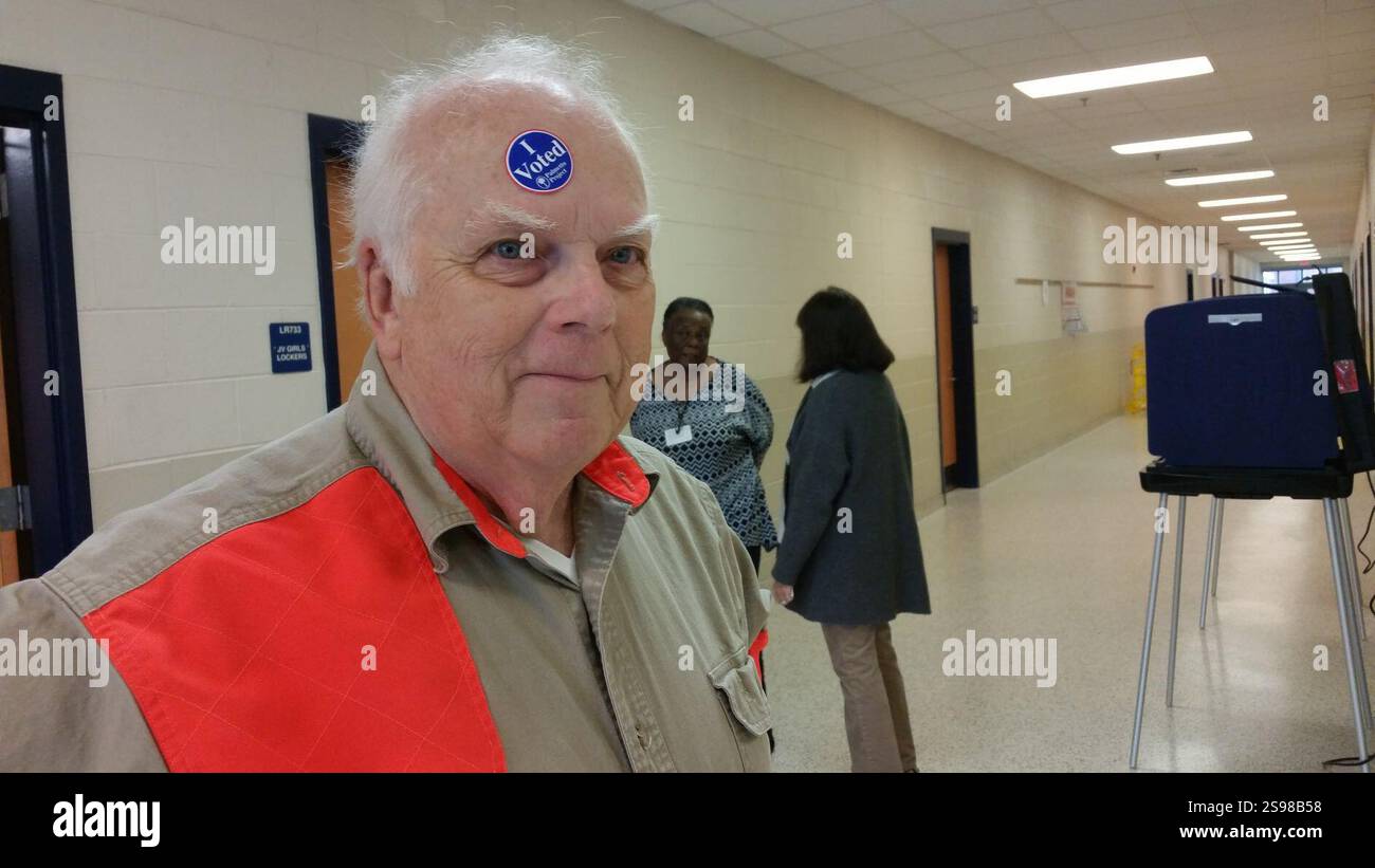 Hal Marshall playfully displays his commitment to voting after casting ...