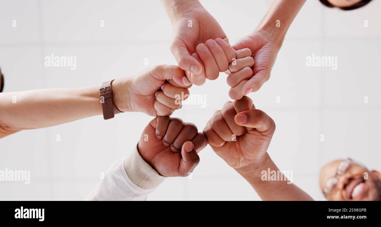 Below, hands and people with fist bump for teamwork, creative ...