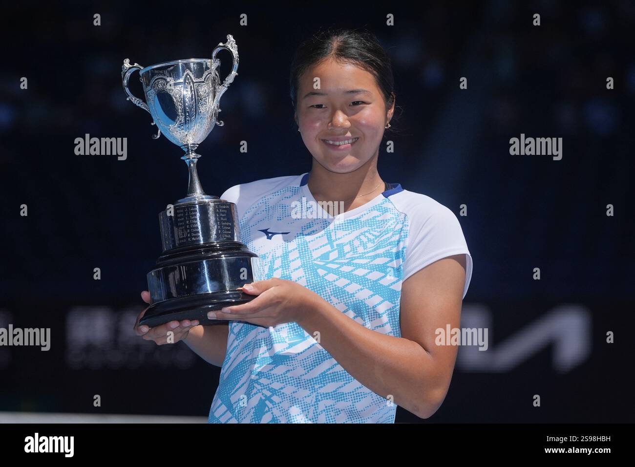 Wakana Sonobe of Japan holds her trophy after defeating Kristina ...