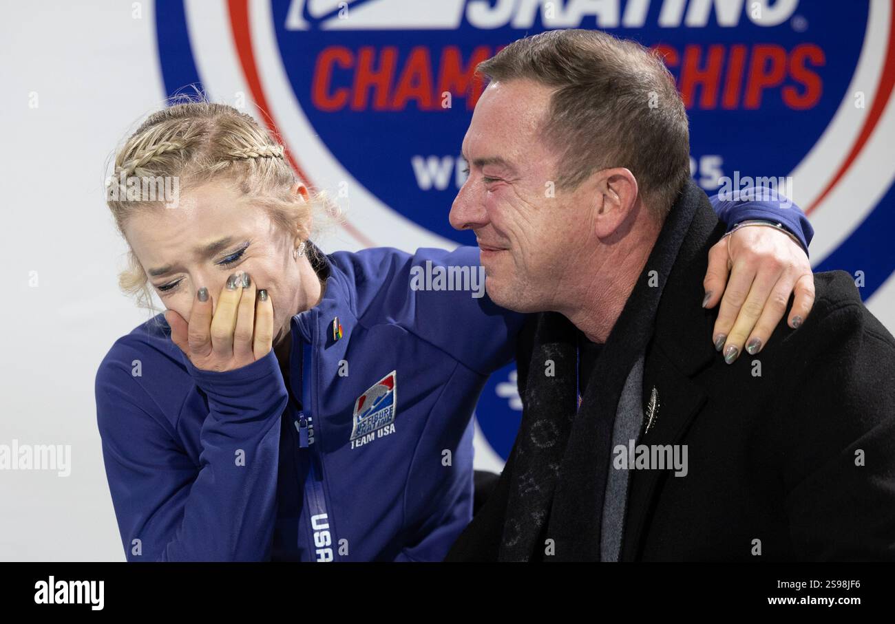 Amber Glenn, left, reacts with her coach Damon Allen, right, after her ...