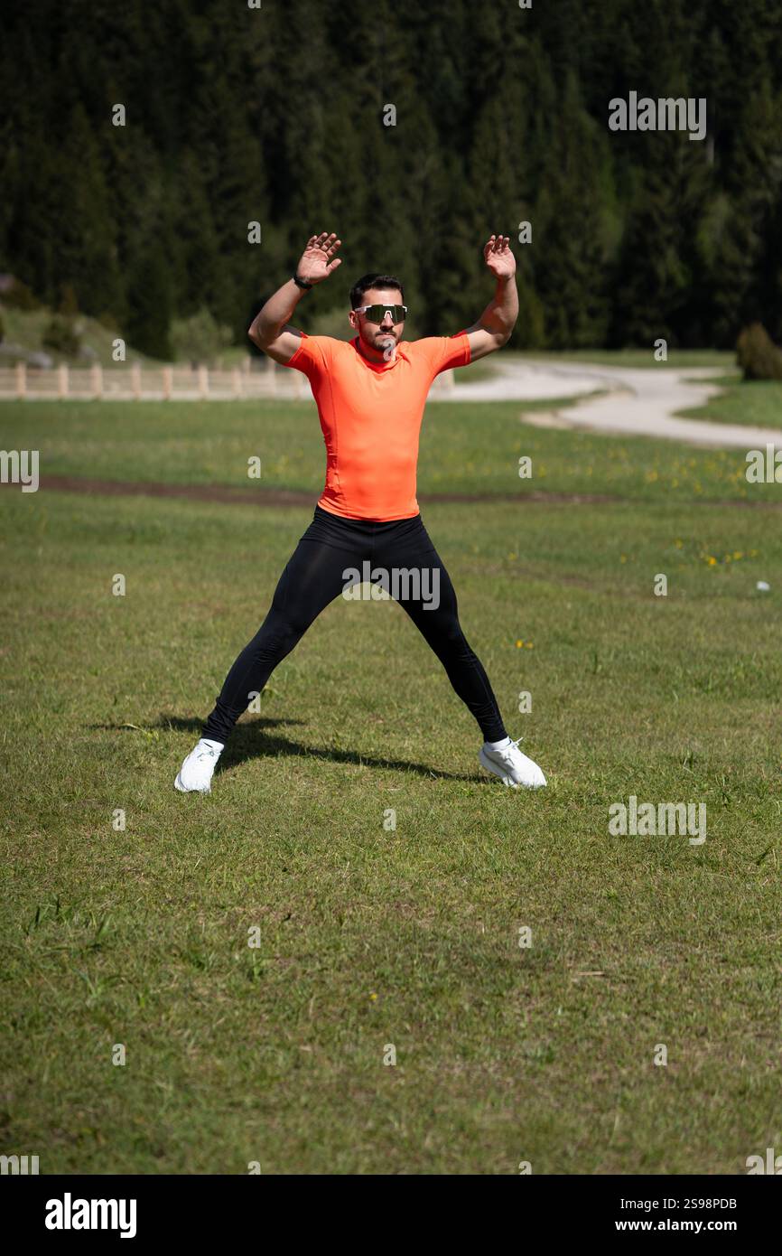 Outdoor Warm-Up Exercise With Jumping And Stretching Movements Stock ...