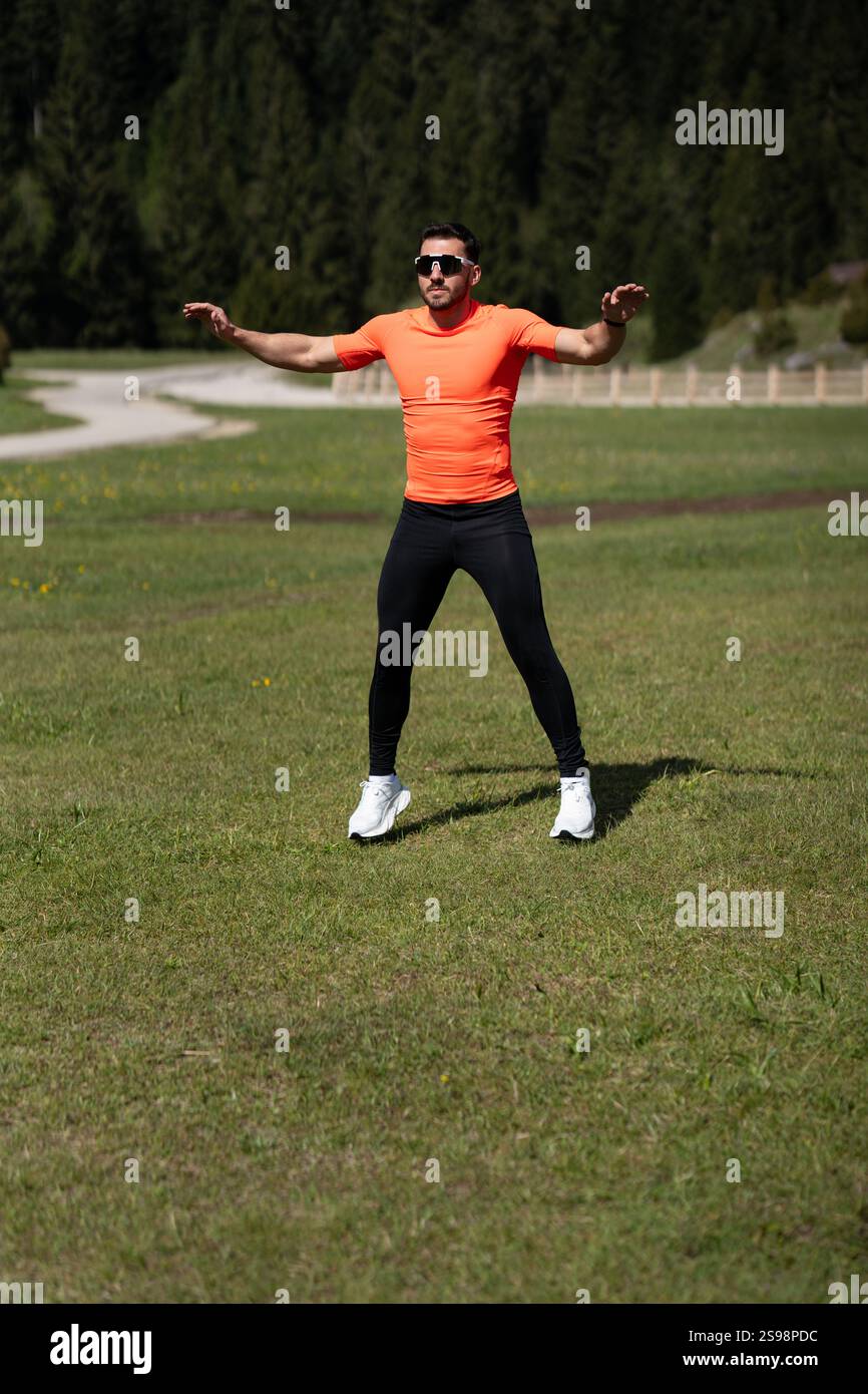 Outdoor Fitness Routine With Gentle Jumps And Arm Movements Stock Photo ...