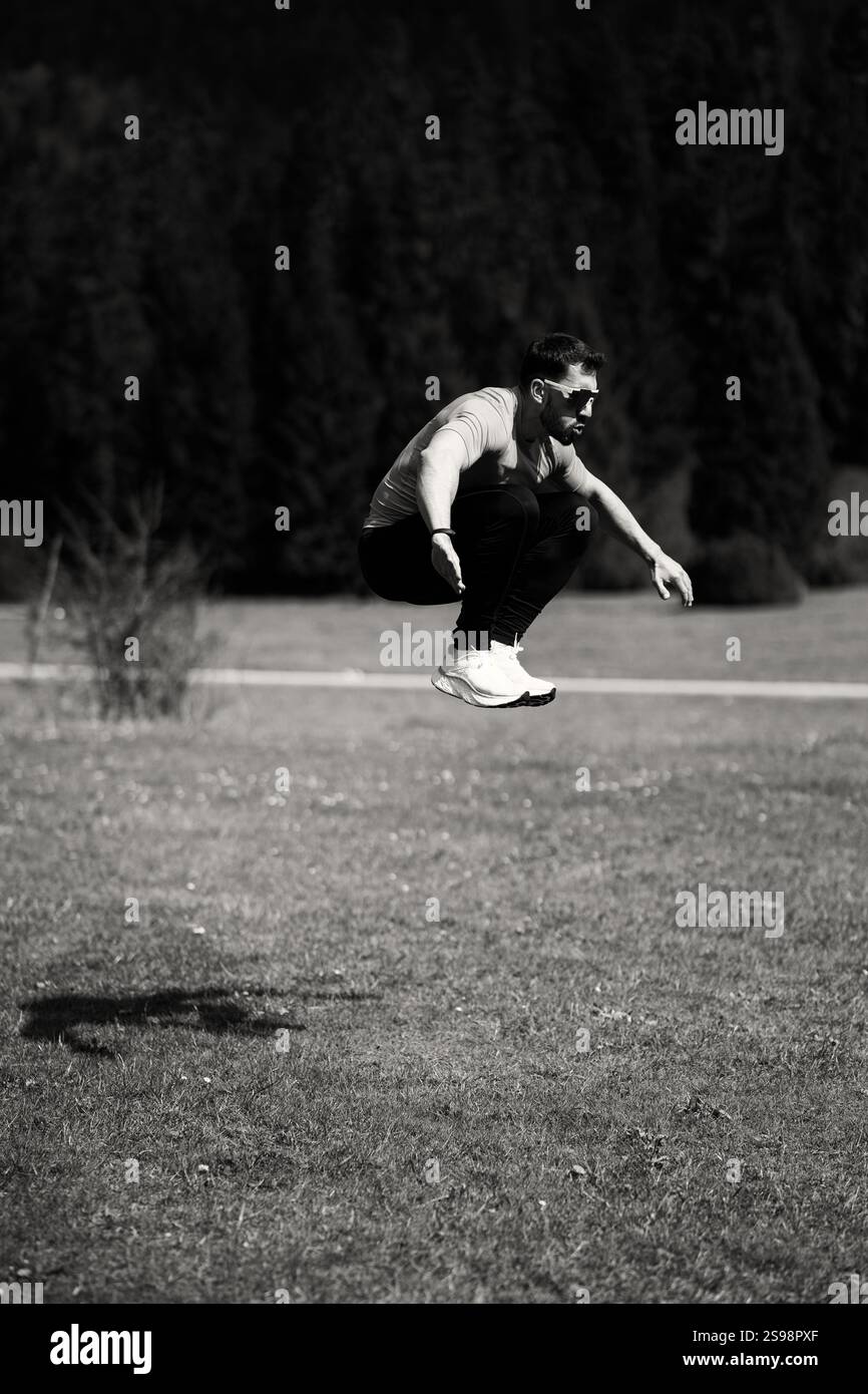 Athlete Practicing Vertical Jumps Surrounded By Nature Stock Photo - Alamy